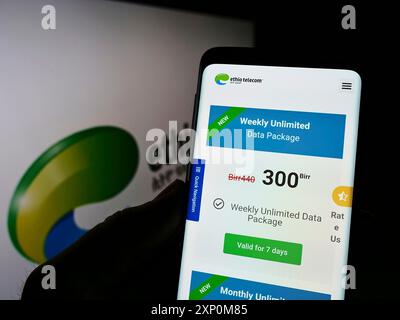 Stuttgart, Germany, 01-09-2022: Person holding mobile phone with logo ...