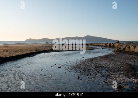 Wainui stream at Whareroa beach with Kapiti Island in the distance, in ...
