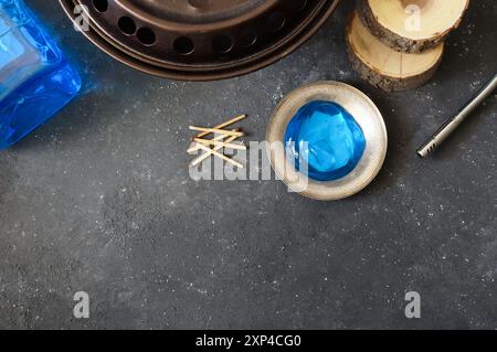 Chafing fuel gel poured into metal dish with matchsticks, blue chafer ...