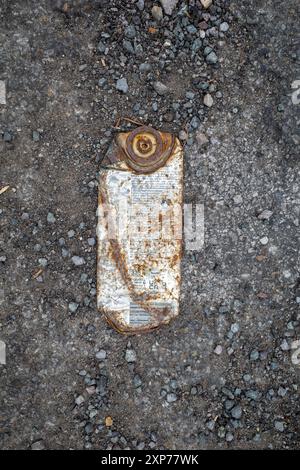 Crumpled and rusty tin can on white background Stock Photo - Alamy