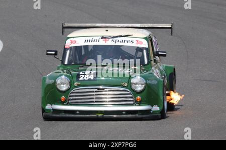 Driver Harvey Death (Green number 60) flare from his car during Track ...
