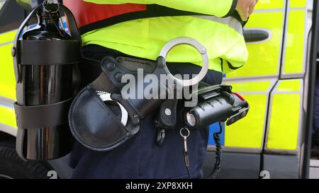 Handcuffs and PAVA spray on a policeman's duty belt Stock Photo - Alamy