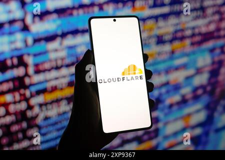In this photo illustration, a Cloudflare logo is displayed on a ...