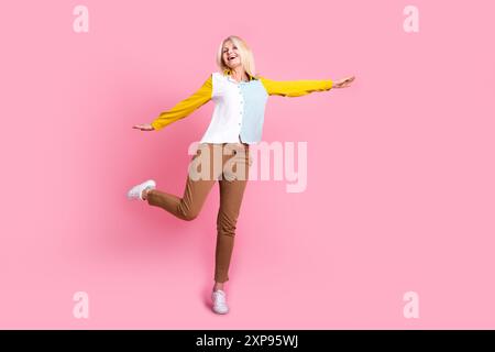 Photo of funky blond young lady show v-sign wear white shirt isolated ...