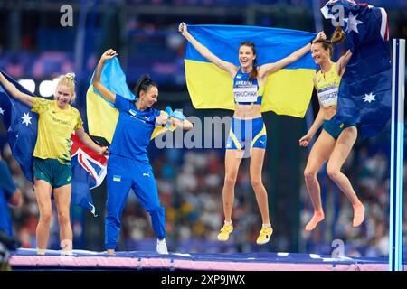 Gold medalist team Australia celebrate on the podium after the women's 4x100-meter freestyle ...
