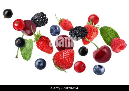 Different fresh berries in air on white background Stock Photo - Alamy