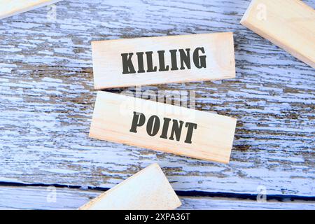 Word KILLING POINT Written a conceptual phrase on the blocks Stock ...