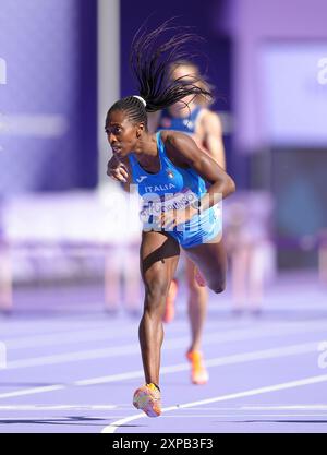 Ayomide Folorunso, of Italy, competes in the women's 400-meter hurdles ...