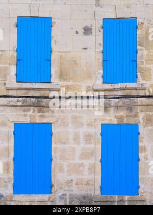Four windows with blue shutters in Provence France Europe Stock Photo ...