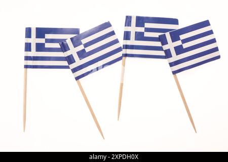 Small paper flags of Greece isolated on white Stock Photo - Alamy