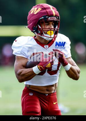 Washington Commanders running back Austin Ekeler (30) looks on before ...