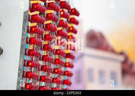 A view of a lightbulb design on the side of a carnival ride Stock Photo ...