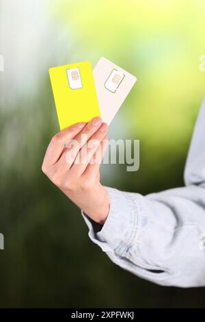 Female hand holding sim cards on white background, closeup Stock Photo ...