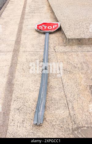 stop road sign laying on the ground Stock Photo - Alamy