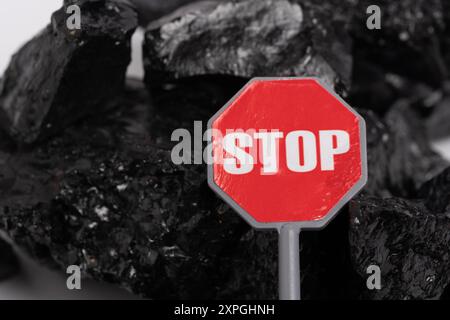 Stop sign on coal background. Conceptual image of danger and caution ...