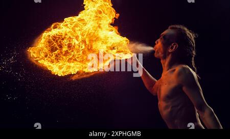 Male Fire Performer With Dreadlocks Skillfully Exhales Massive Fireball ...