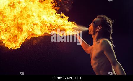 Male Fire Performer With Dreadlocks Skillfully Exhales Massive Fireball ...