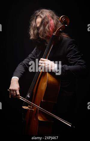 Music Cello in the dark room Stock Photo - Alamy