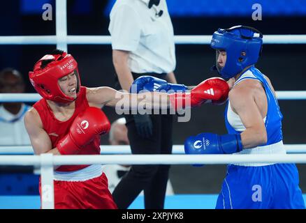 China’s Yu Wu (left) in action against Kazakhstan’s Nazym Kyzaibay ...
