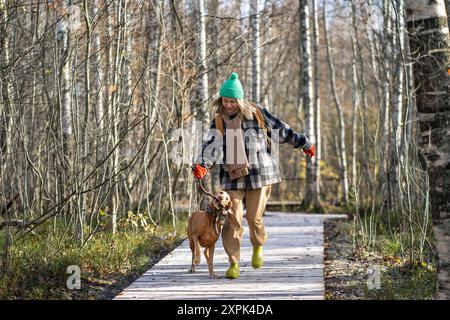 Cheerful woman and dog pet outdoors Stock Photo - Alamy