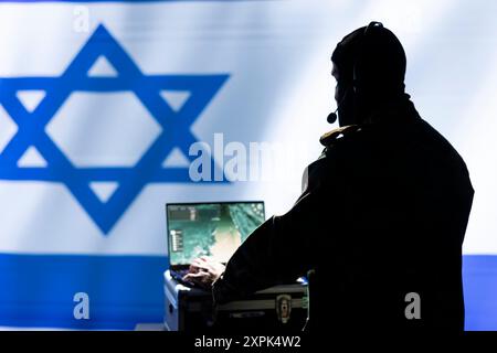 Mossad operative dispatcher talks in headset, relaying surveillance ...