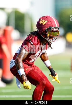 Washington Commanders safety Tyler Owens (40) takes down Baltimore ...