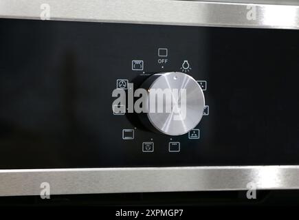Oven knob controller with multi-function settings from side view Stock ...