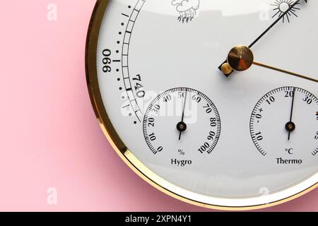 Aneroid barometer on pink background Stock Photo - Alamy