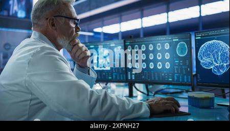 Senior Male Neuroscientist Using Desktop Computer To Analyze MRI Scans ...