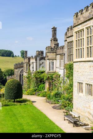 Haddon Hall Derbyshire - Haddon hall gardens topiary and lawn with the crenellated walls of ...