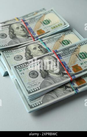 Bundles of dollar banknotes on light grey background Stock Photo - Alamy