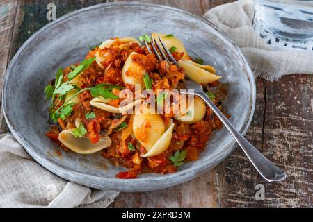 Pasta shells with tomato, mushrooms and chorizo sauce Stock Photo - Alamy
