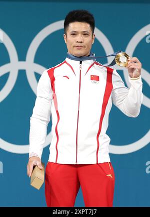 Fabin Li of China, gold medalist in the men's 61kg weightlifting ...