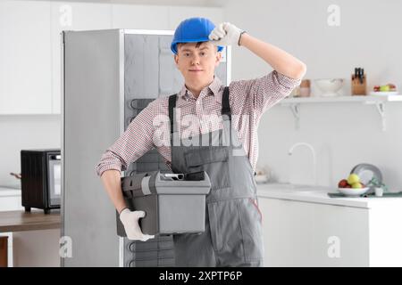 Male technician with bag of tools near air conditioner in room Stock ...