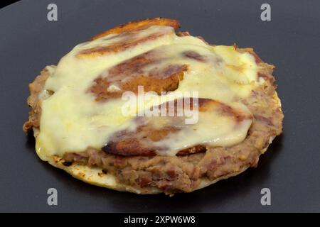 Arepa a grilled cornflour round cake like a tortilla but ticker. With ...