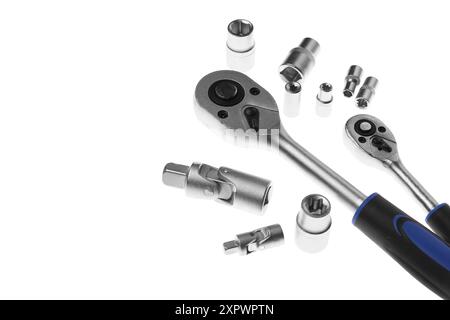 Two torque wrenches and nuts on white, flat lay. Auto mechanic tools ...