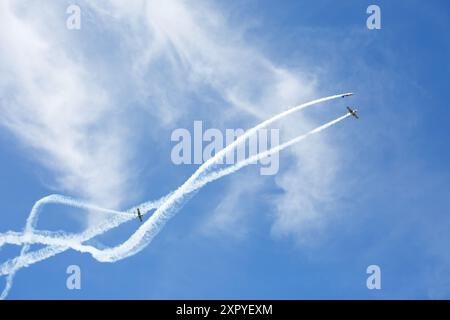 Three propeller planes making stunts at airshow Stock Photo - Alamy
