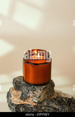 Glass Jar On Stacked Rocks Against Beige Background Stock Photo - Alamy