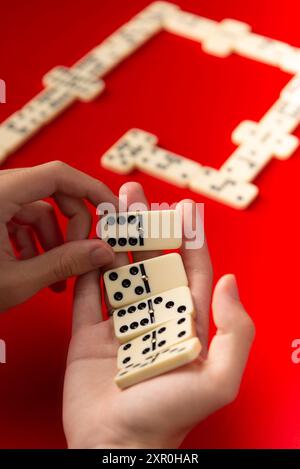Hands of domino players Stock Photo - Alamy