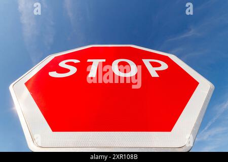 stop sign isolated against blue sign france Stock Photo - Alamy