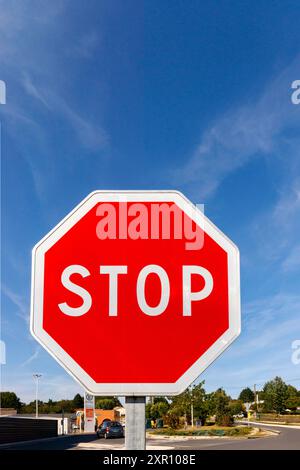 stop sign isolated against blue sign france Stock Photo - Alamy