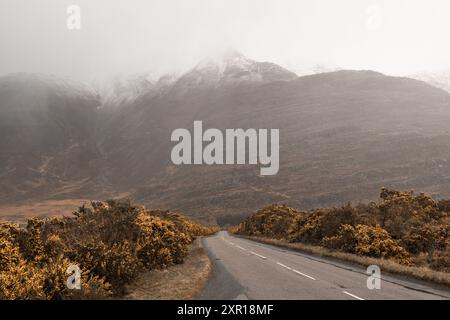 A scenic Scottish Highlands disappearing into misty mountains, with ...