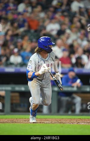 New York Mets' Jesse Winker runs after hitting a single against ...