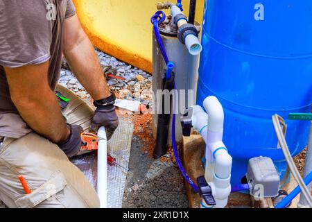 PVC pipe is being connected to water supply artesian well system pump ...
