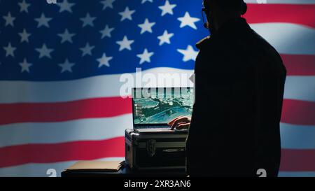US Air Force agent using radar system on laptop to detect incoming ...