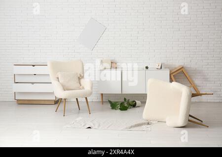 Interior of damaged living room with armchairs and pouf after ...