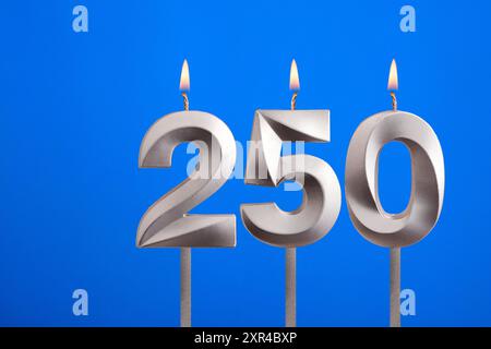 Lit birthday candle - Candle number 250 on white background Stock Photo ...