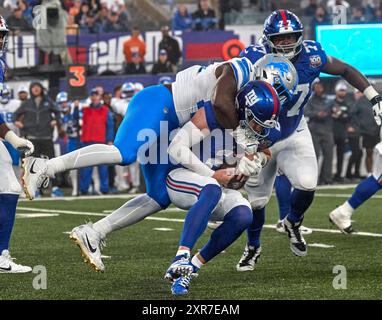 Isaac Ukwu, a defensive end for the Detroit Lions, acts out a scene ...