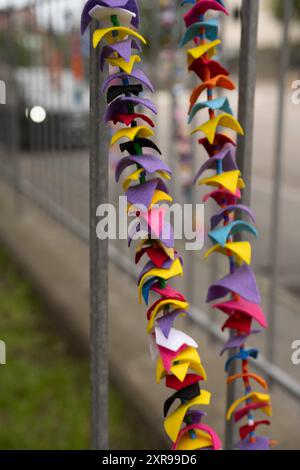 Striped square toy on a blue and green surface Stock Photo - Alamy