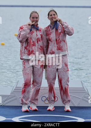 Sloan Mackenzie and Katie Vincent of Canada compete during Women's ...